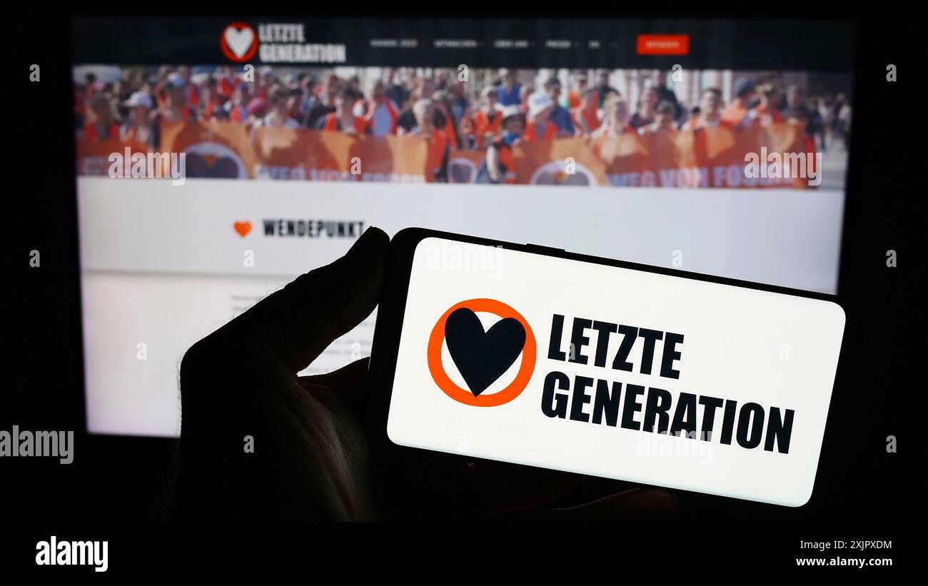 Stuttgart, Germany, 10-10-2023: Person holding smartphone with logo of ...