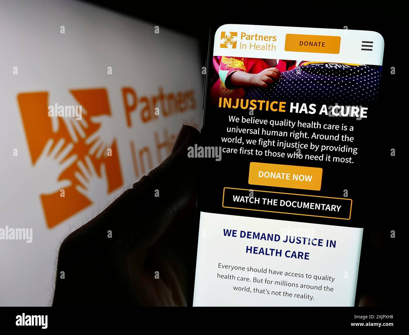 Stuttgart, Germany, 10-10-2023: Person holding cellphone with website of US organization ...