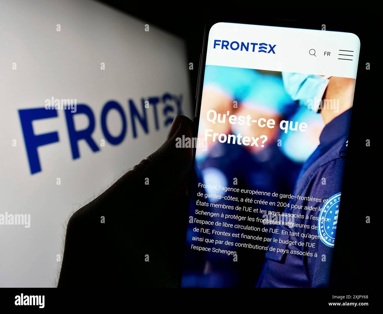 Stuttgart, Germany, 10-25-2023: Person holding smartphone with webpage ...