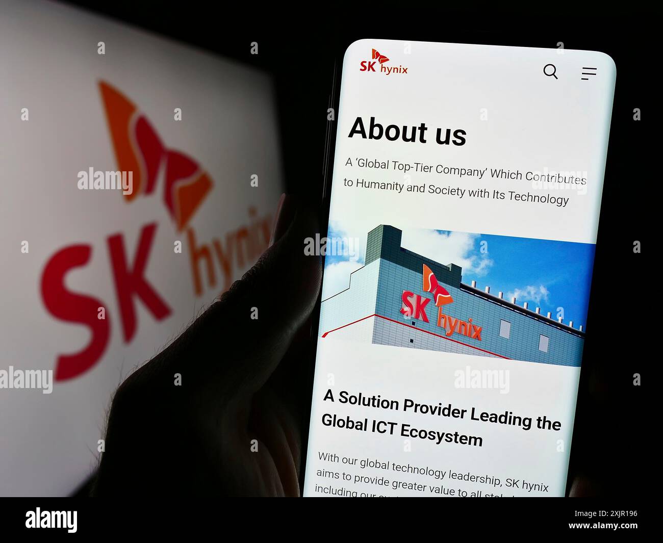 Stuttgart, Germany, 11-16-2023: Person holding cellphone with webpage of South Korean ...