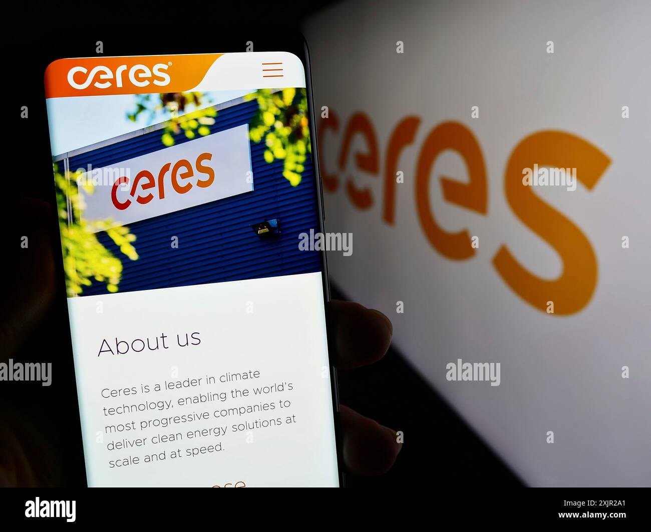 Stuttgart, Germany, 12-06-2023: Person holding cellphone with web page of British fuel cell ...