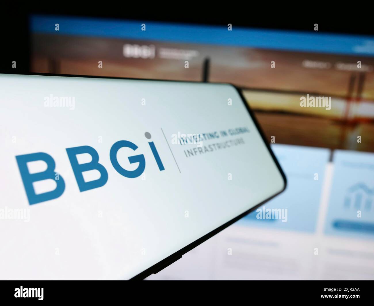 Stuttgart, Germany, 12-02-2023: Mobile phone with logo of investment company BBGI Global ...