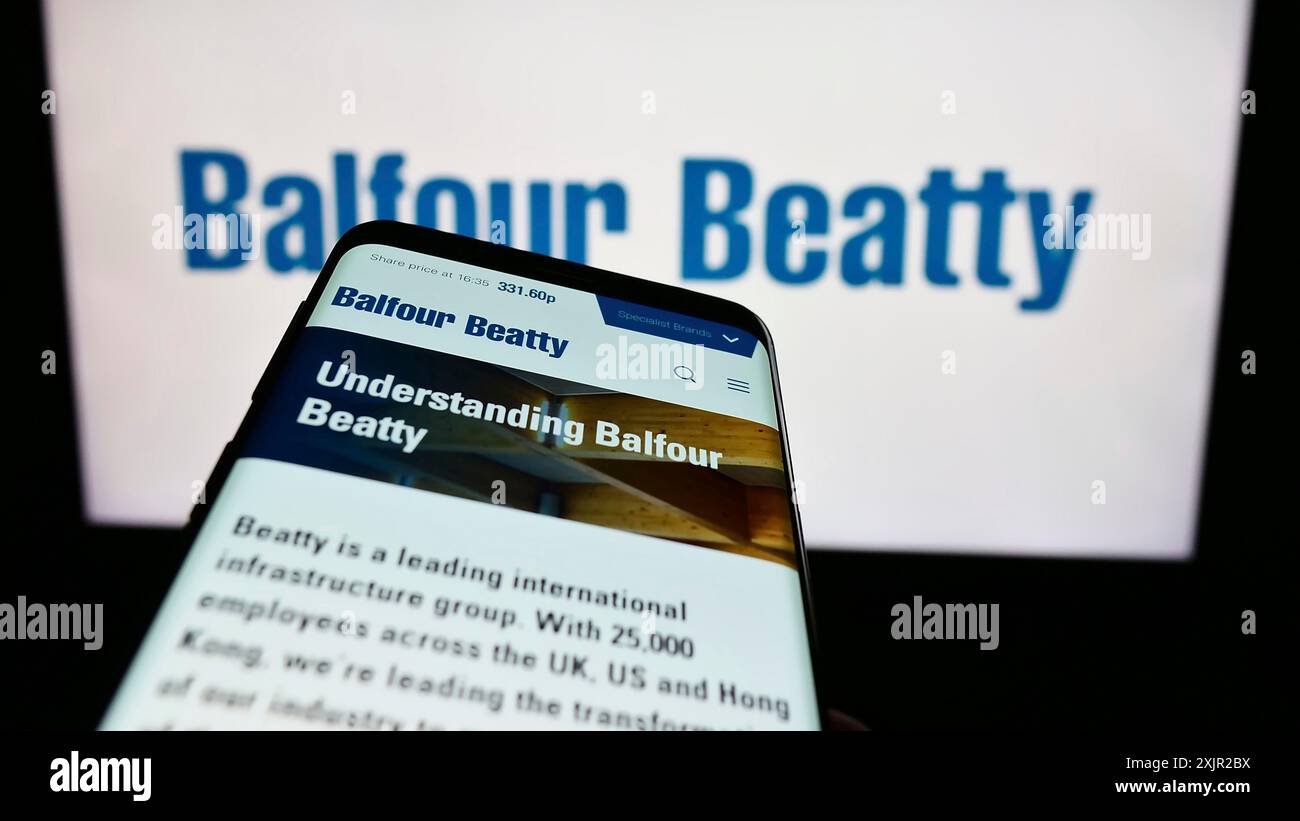 Stuttgart, Germany, 12-02-2023: Smartphone with website of British infrastructure company ...