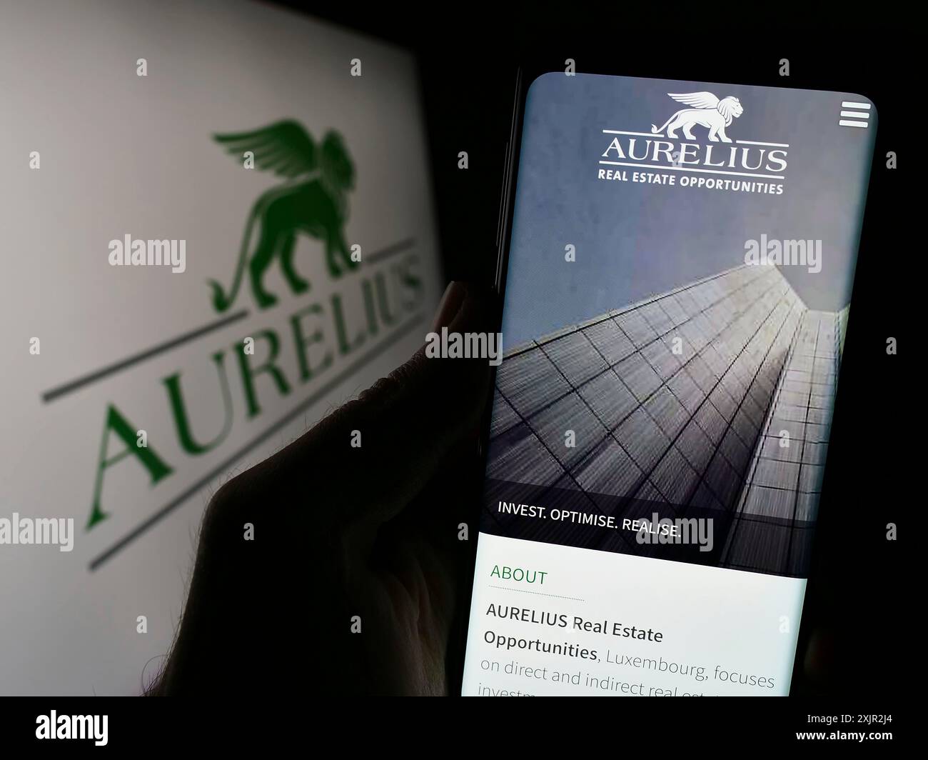 Stuttgart, Germany, 12-08-2023: Person holding smartphone with webpage of European investment ...