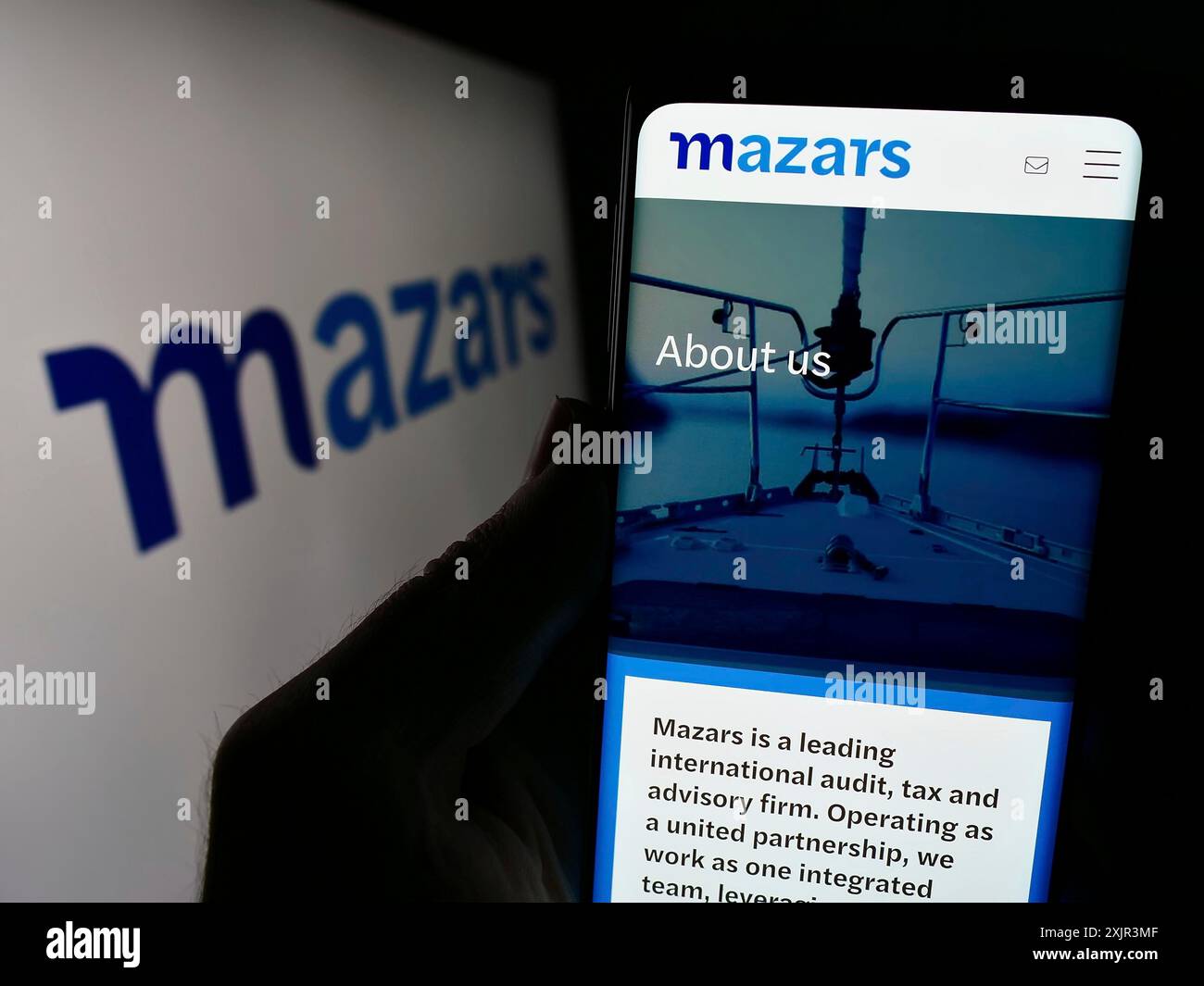 Stuttgart, Germany, 12-22-2023: Person holding cellphone with webpage ...