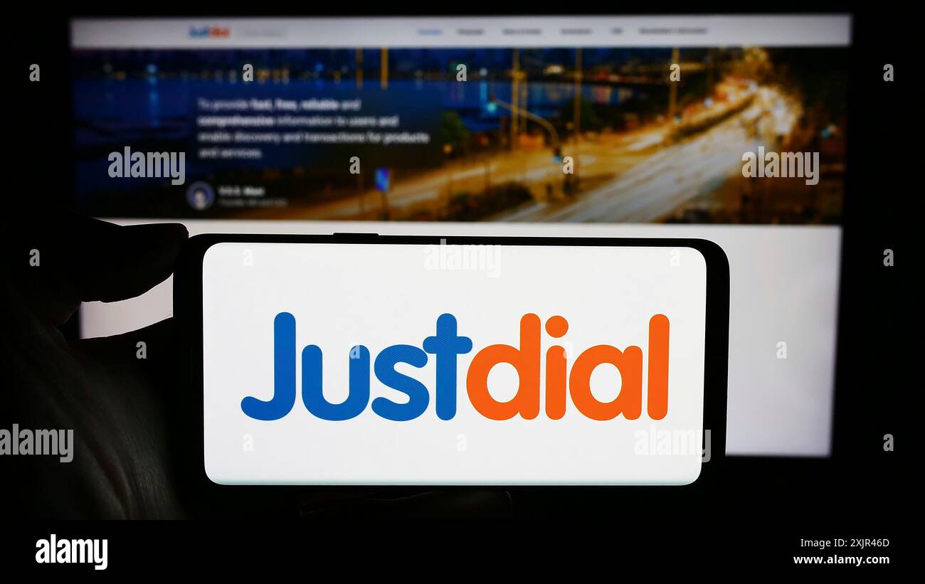 Stuttgart, Germany, 12-31-2023: Person holding cellphone with logo of ...