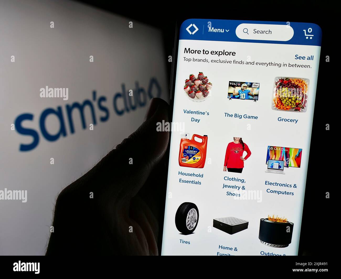 Stuttgart, Germany, 02-07-2023: Person holding smartphone with webpage of US membership-only ...