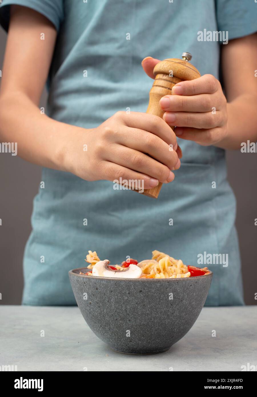 Putting pepper in pasta hi-res stock photography and images - Alamy