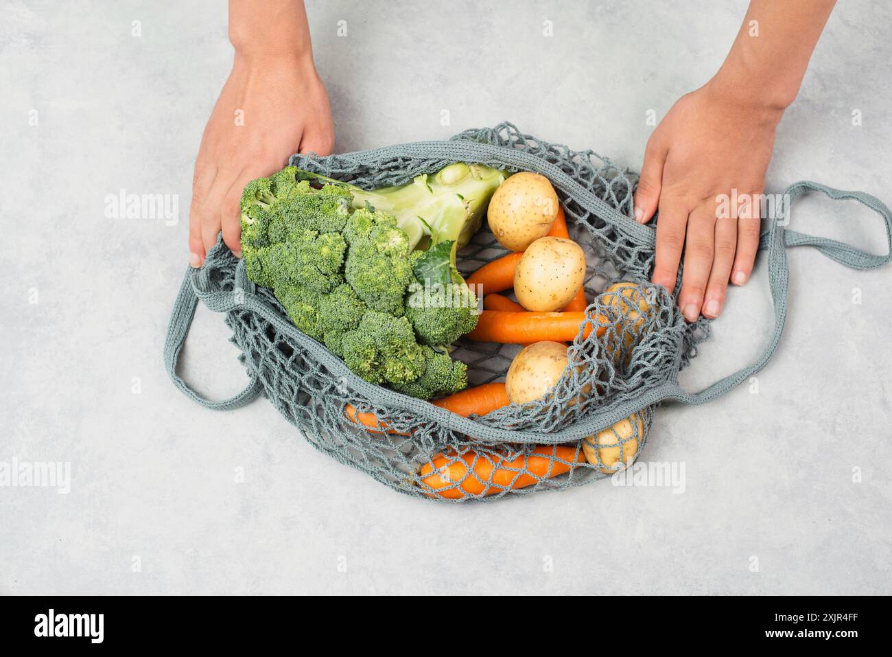 Mesh bag with vegetables, shopping grocery, healthy food ingredients ...