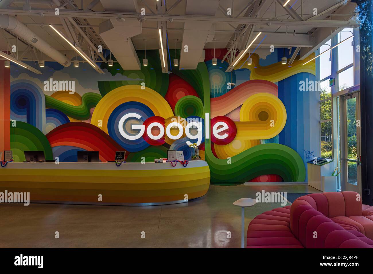 Google sign on the wall behind the reception desk at the Google ...