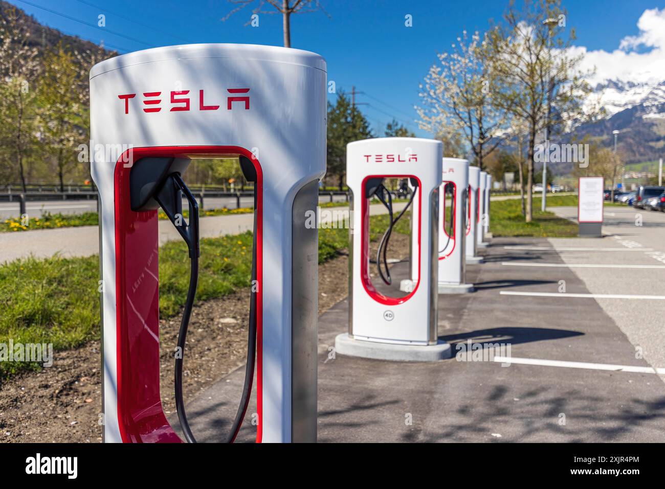 Tesla Superchargers on a parking lot Stock Photo - Alamy
