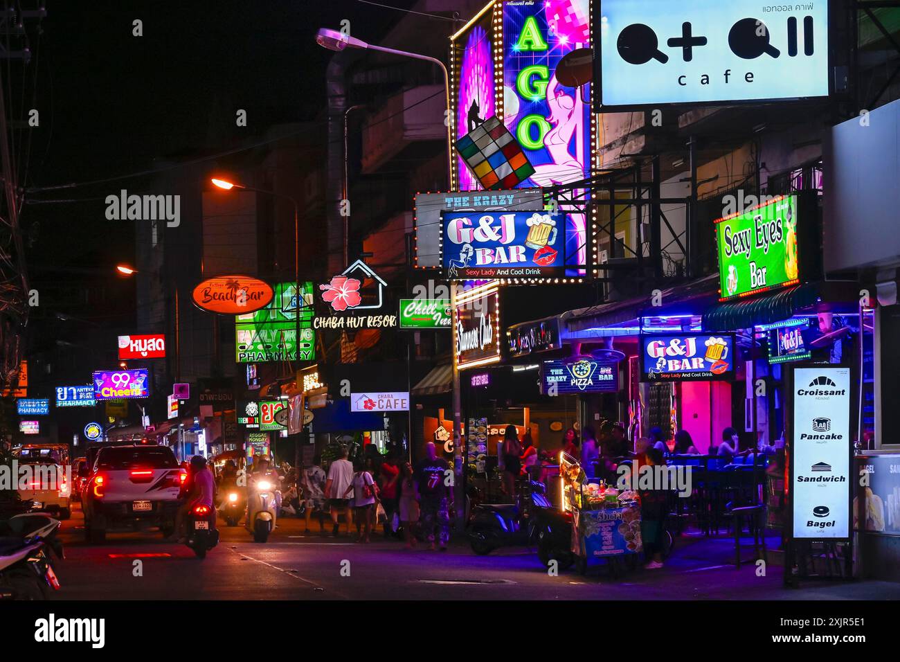 Nightlife illuminated bar signs Stock Photo - Alamy