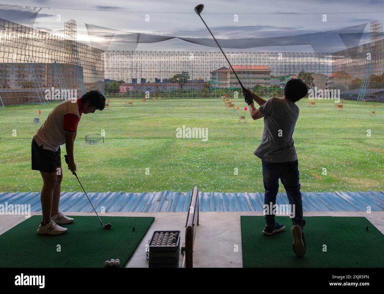 Golf driving range tee Stock Photo - Alamy