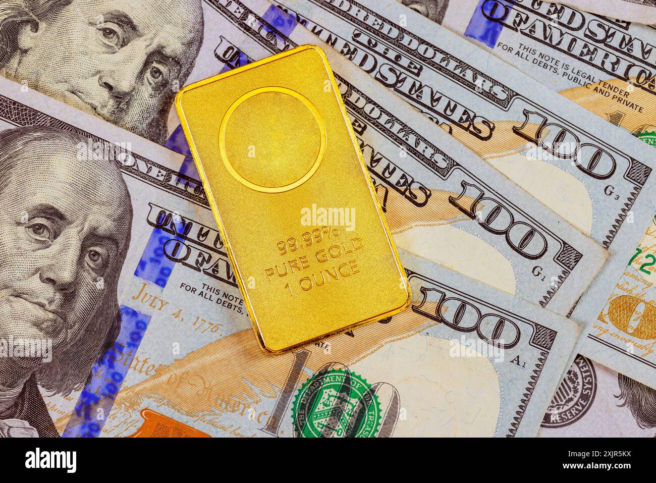 Banknote containing American dollars, is an investment to gold bars ...