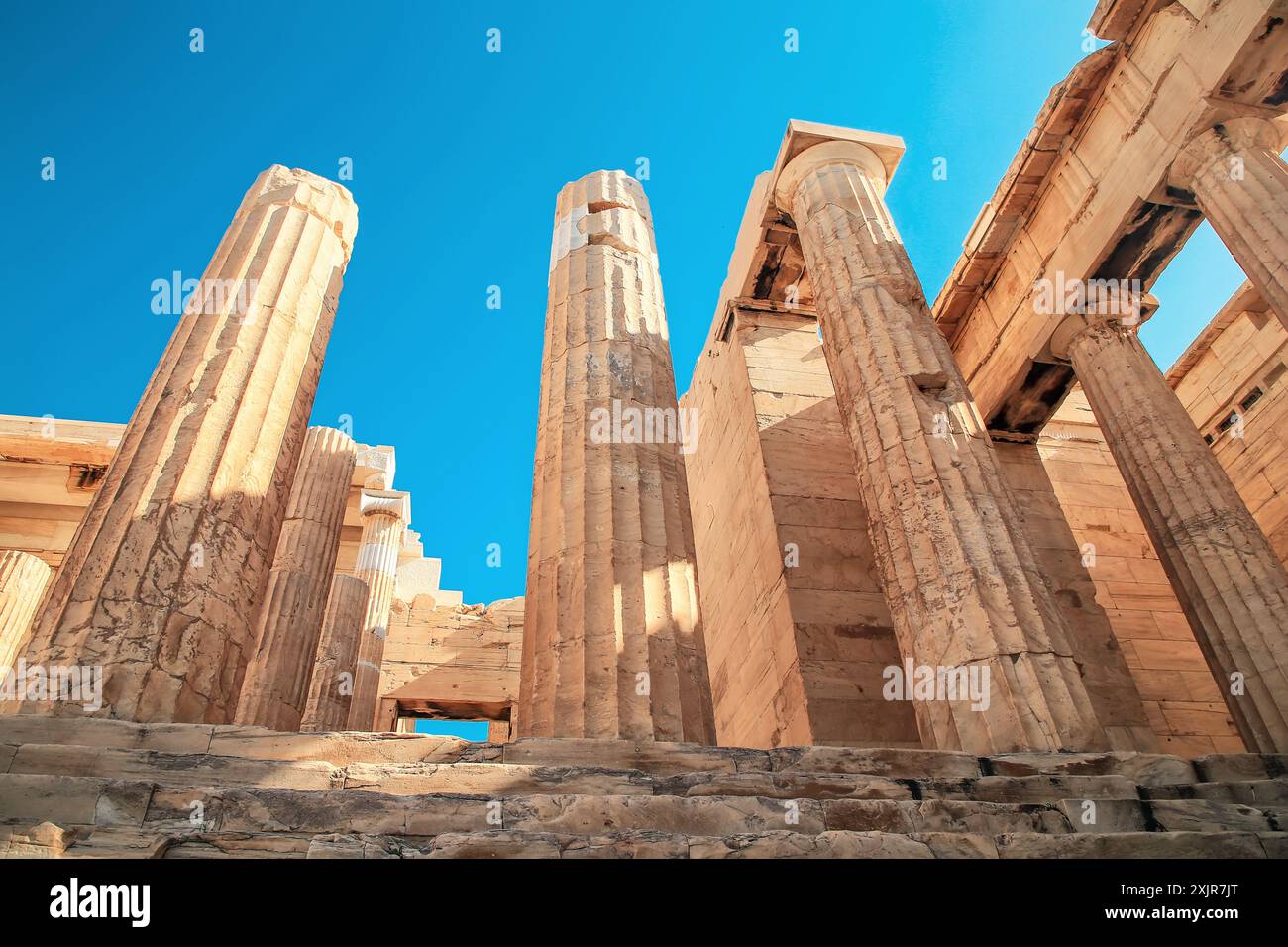 Looking up at a columns of Propylaea gateway in Acropolis of Athens, Greece Stock Photo - Alamy