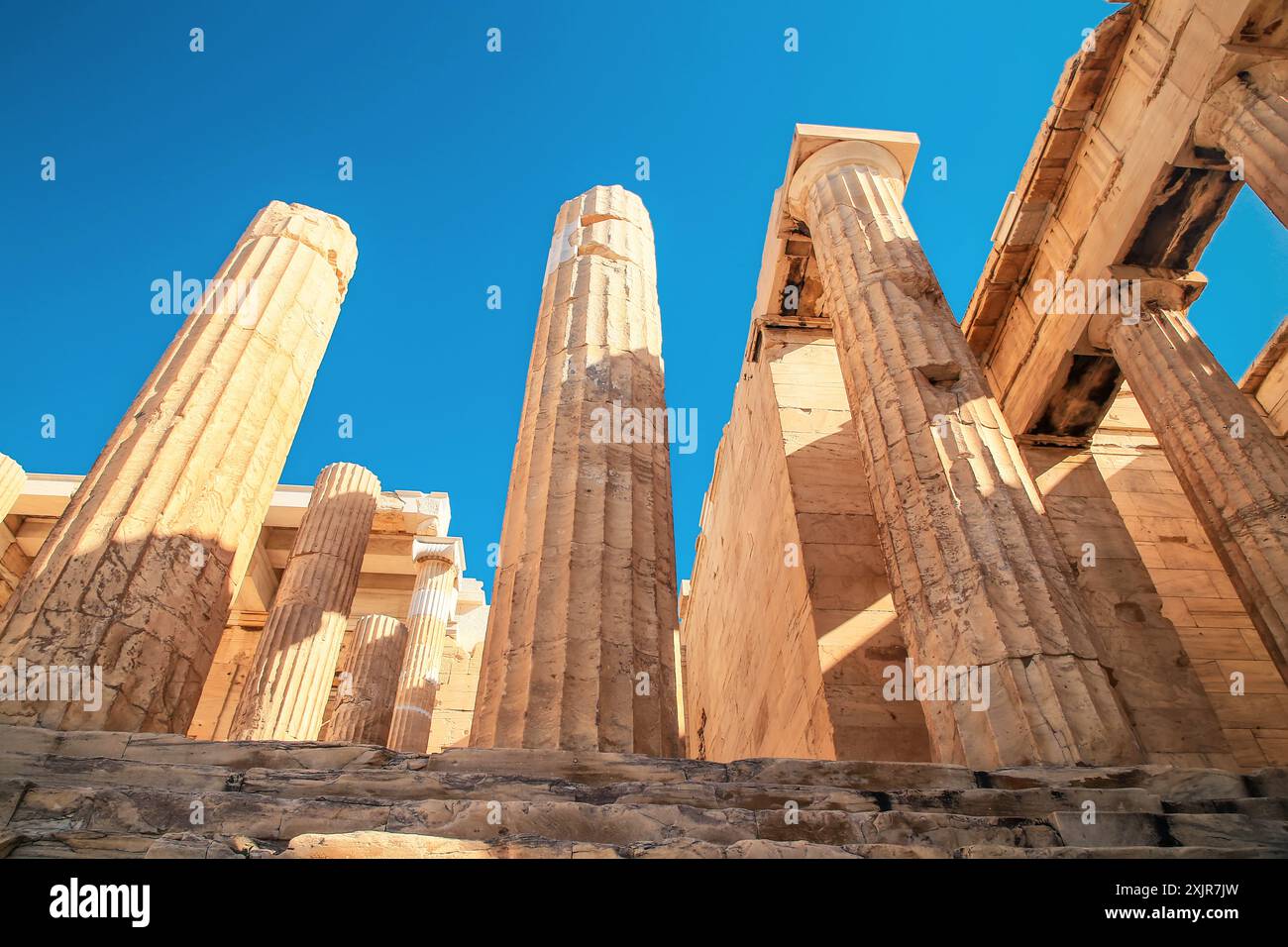 Looking up at a columns of Propylaea gateway in Acropolis of Athens, Greece Stock Photo - Alamy