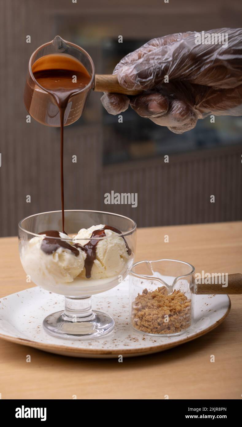 Melted chocolate pours on nuts hi-res stock photography and images - Alamy