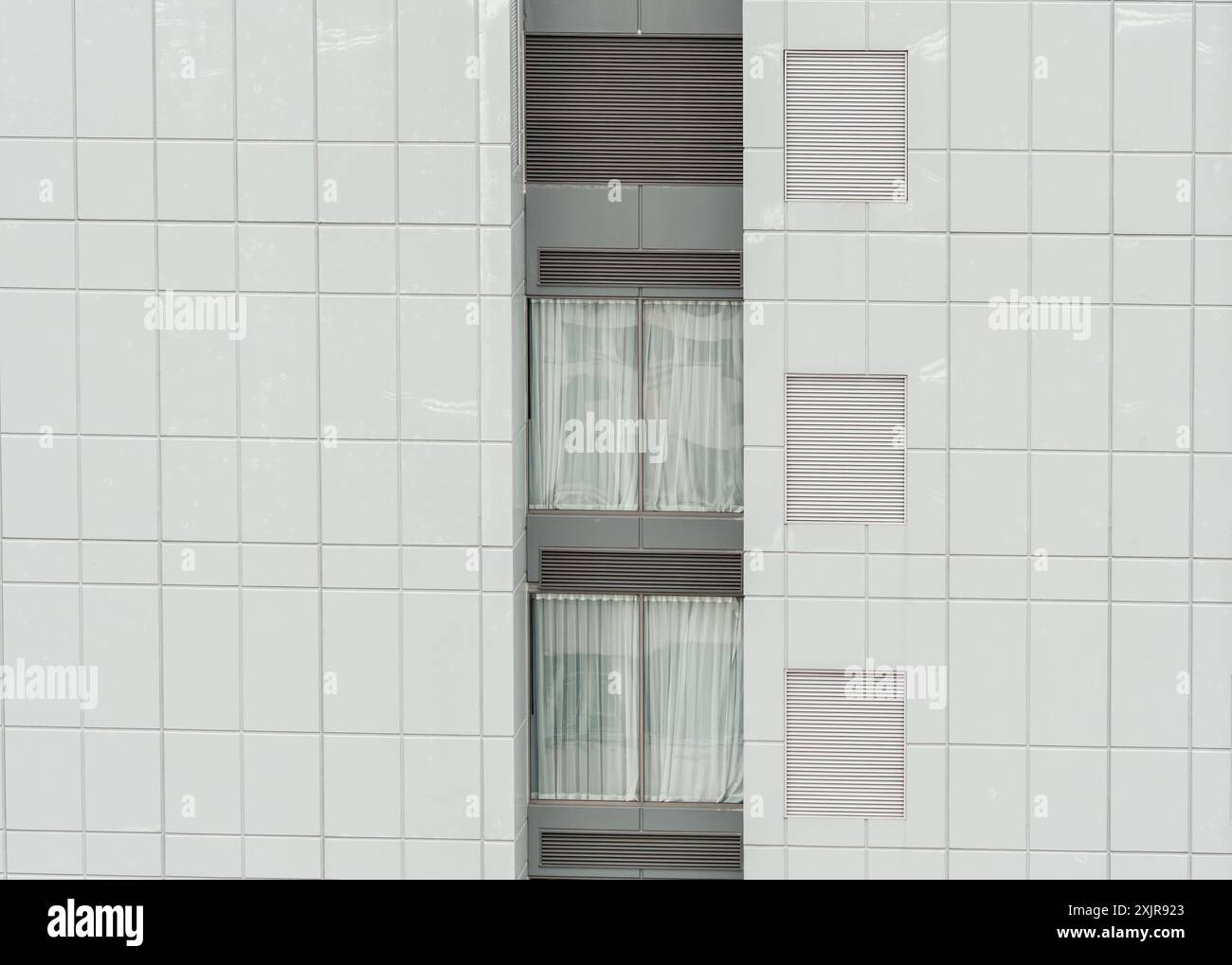 Modern Building Facade With Windows and Vents Stock Photo - Alamy