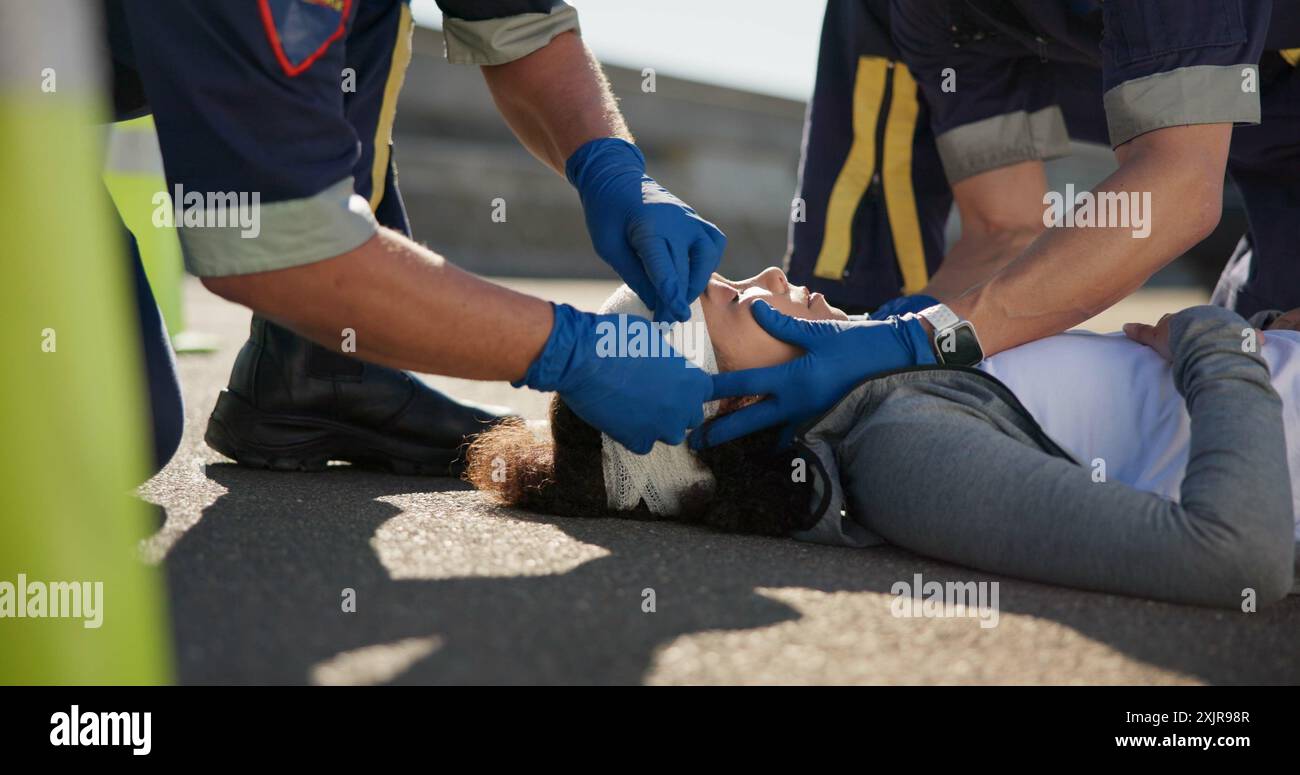 Paramedic, emergency and hands on head injury on road in car crash accident with healthcare help ...