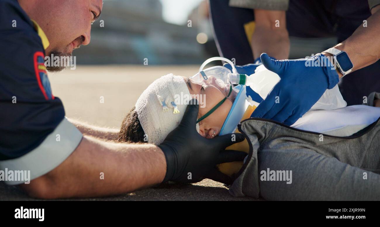 Paramedic, emergency and injury on road with concussion check from ...