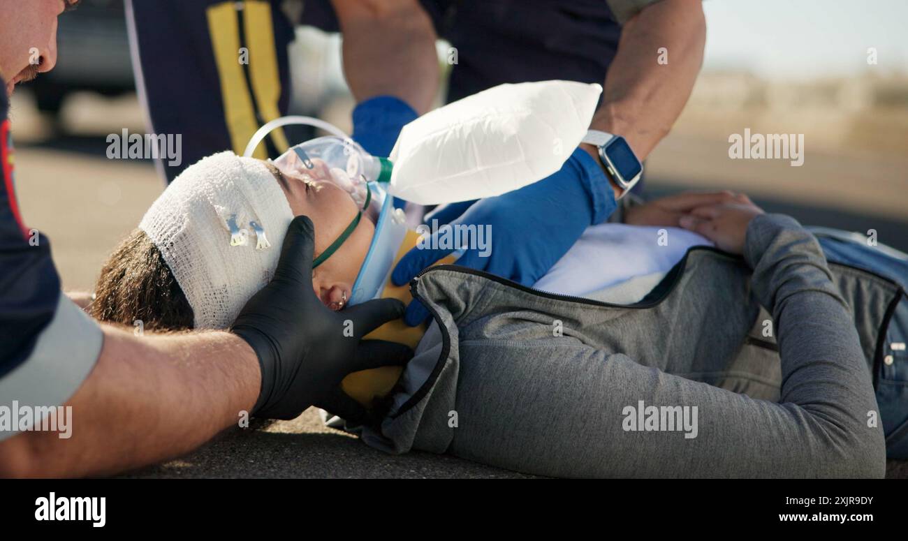 Paramedic, emergency and injury check on road from car crash accident ...