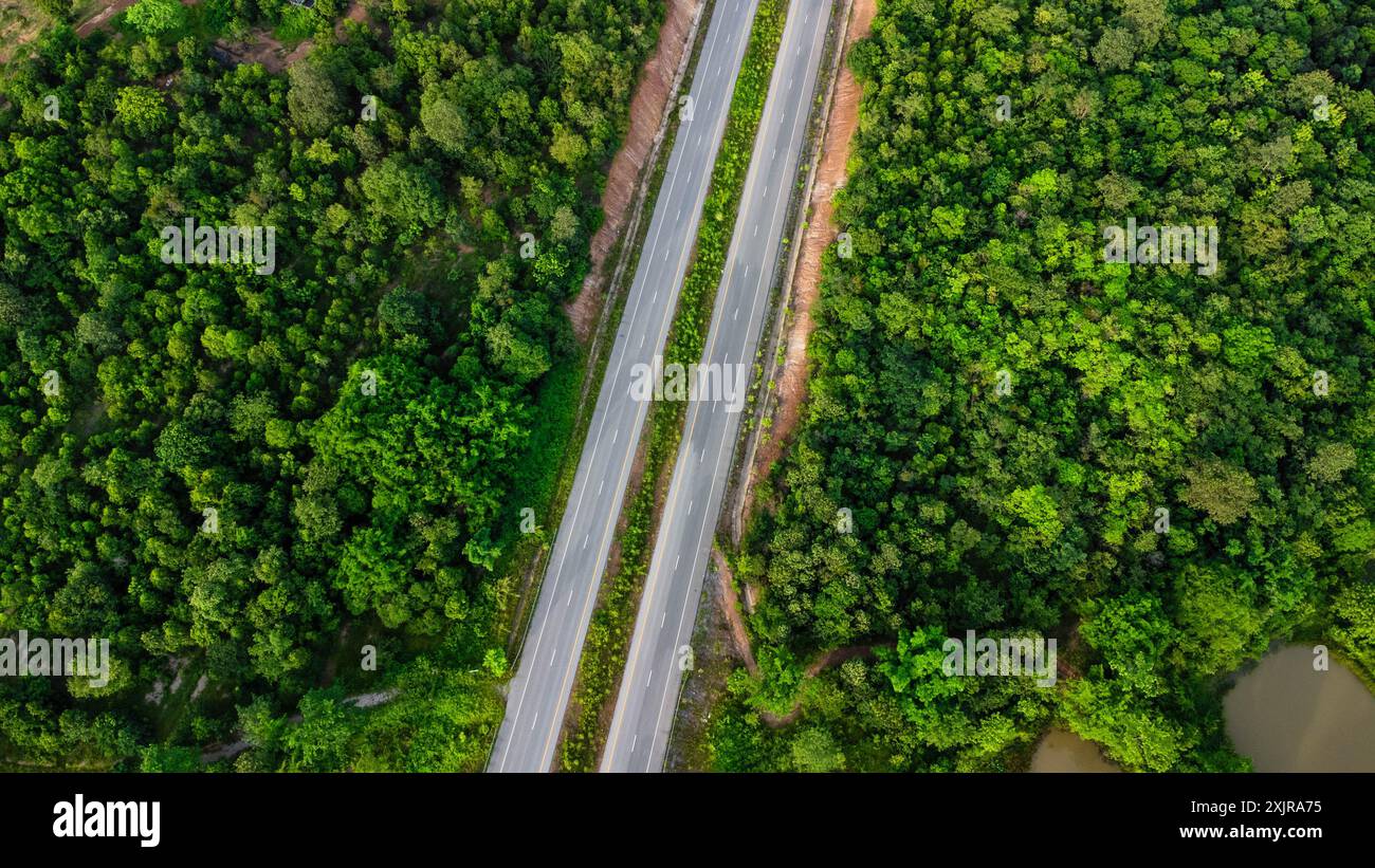 Aerial view of countryside asphalt road with car and green forest ...