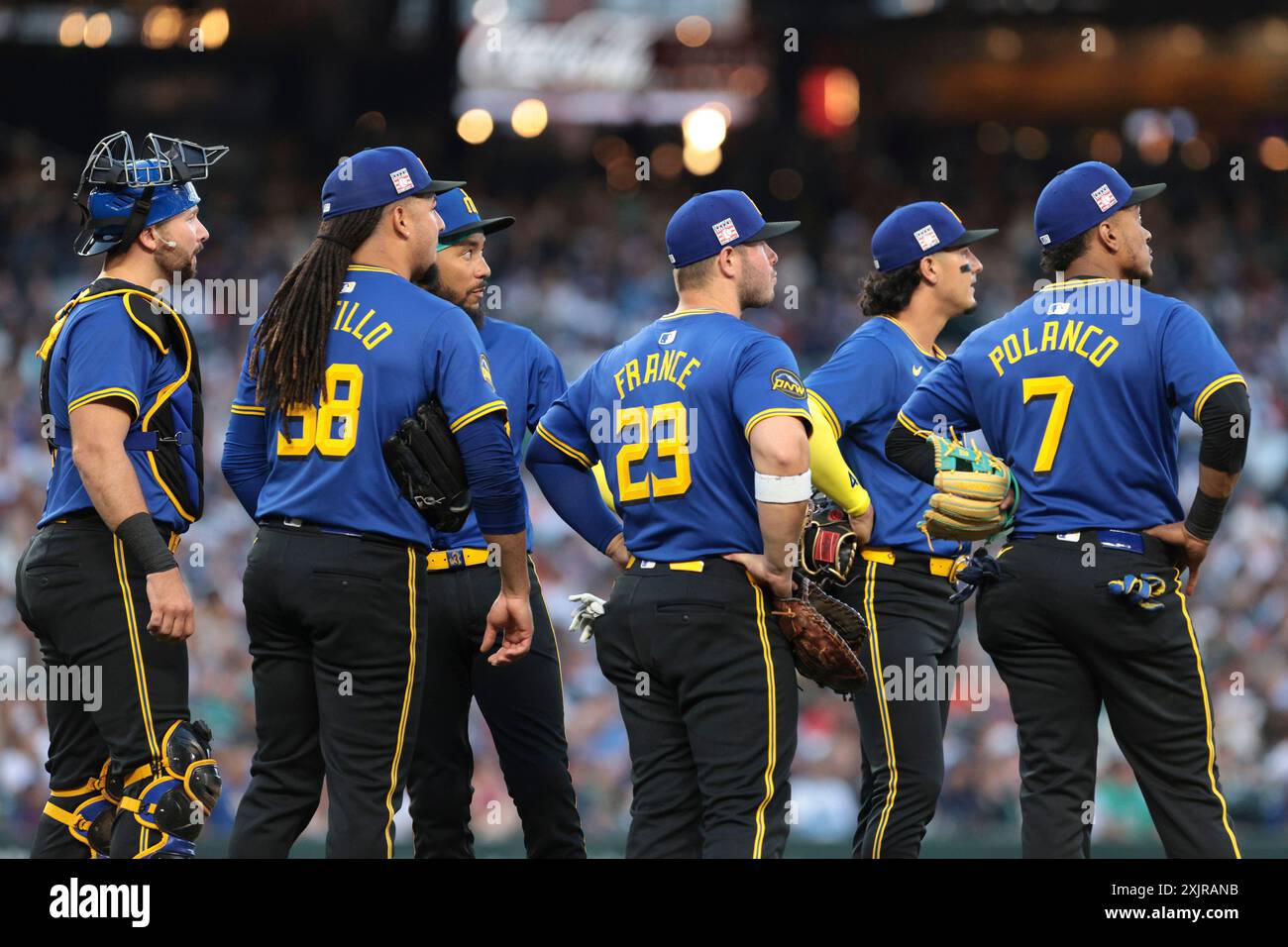 Seattle Mariners players, from left, catcher Cal Raleigh, starting ...