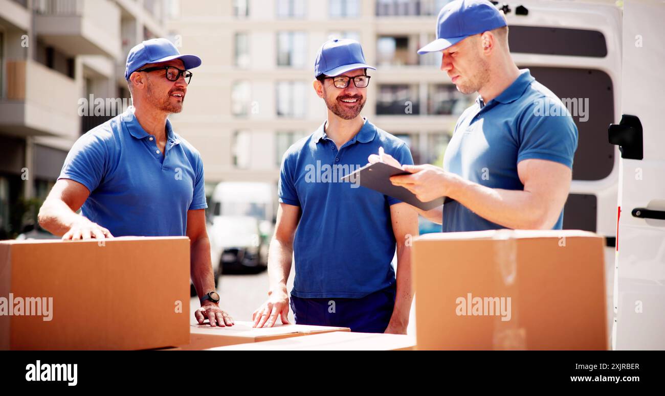 Experienced Delivery Agent Checking Shipment in Warehouse, Noting ...