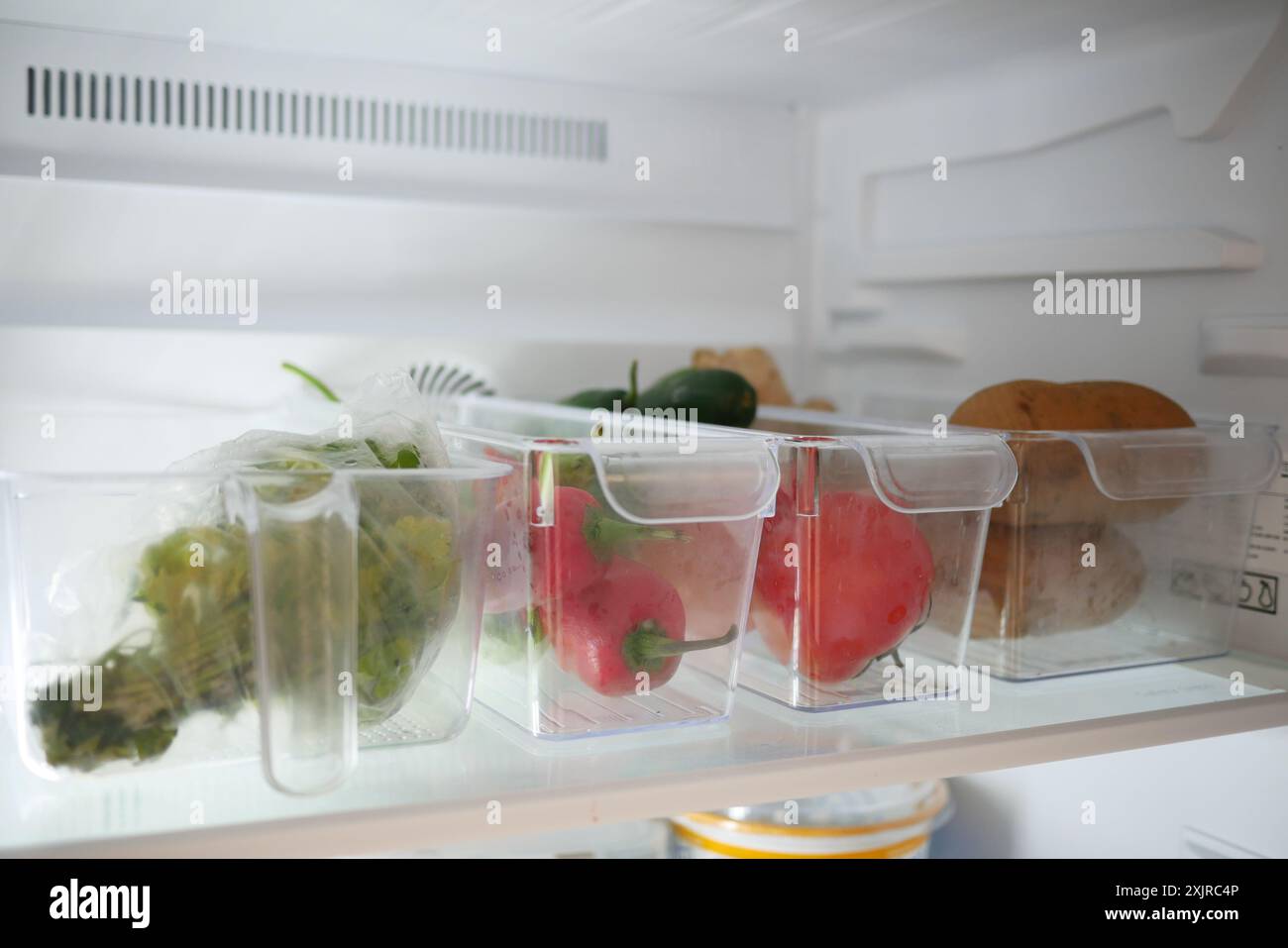 plastic containers with different fruits in a open fridge Stock Photo ...