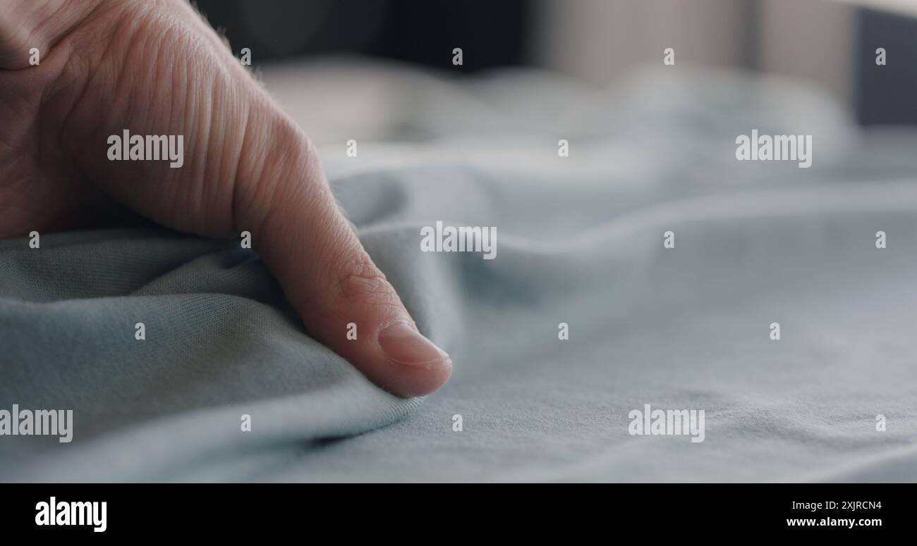 Finger touching cloth hi-res stock photography and images - Alamy