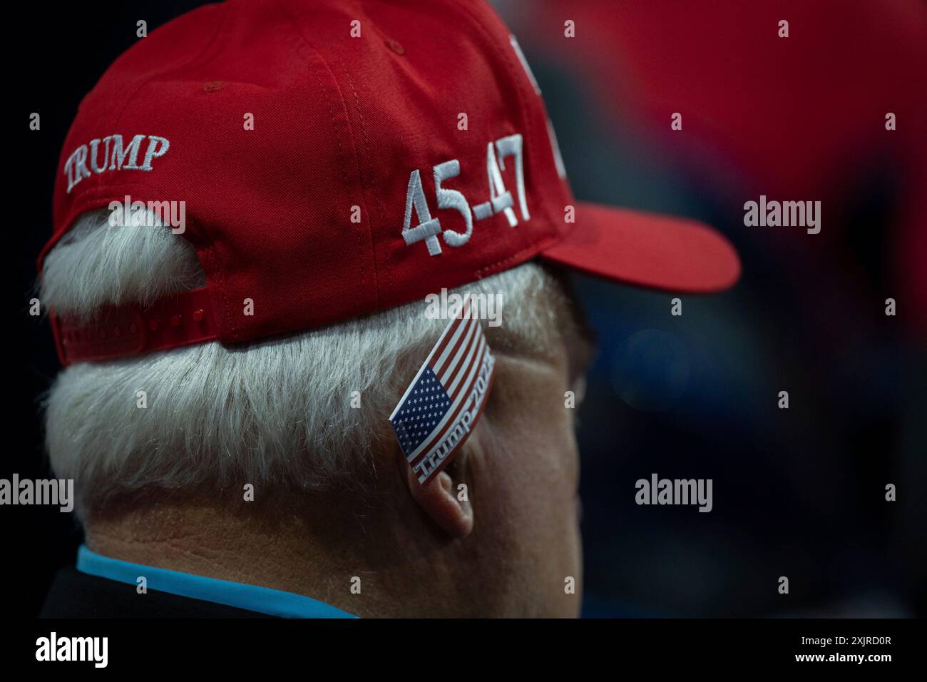 An attendee wears a â Trump 2024â ear cover to match Trumpâ s ear ...