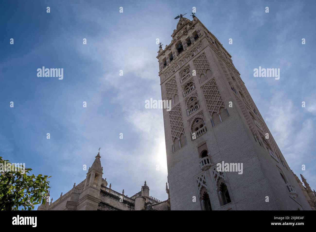 Detail of the Giralda, the bell tower of the Cathedral of Seville, a ...