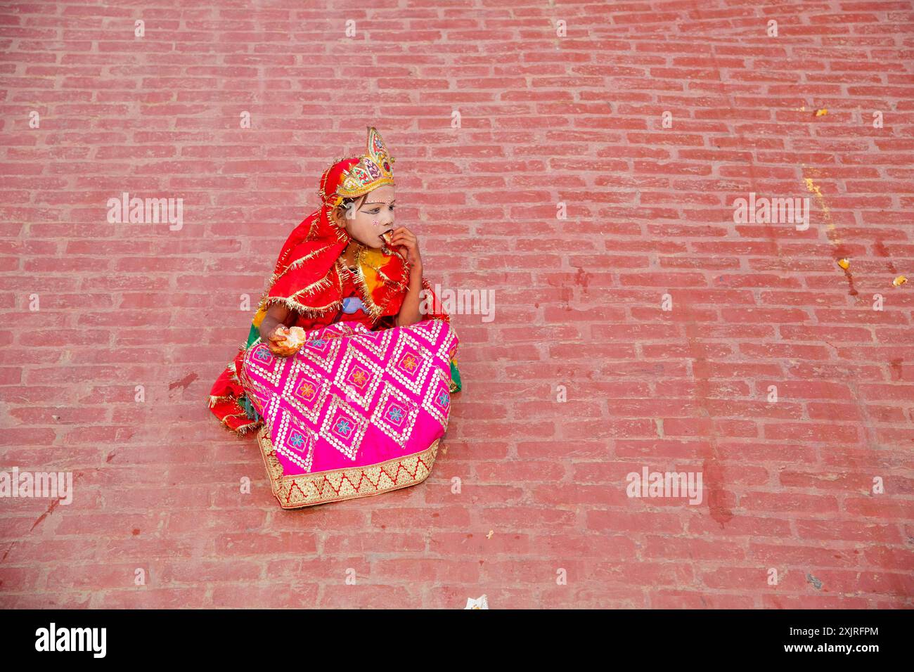 Portrait of a poor kid dressed as Lord Shiva and Goddess Parvati with a ...