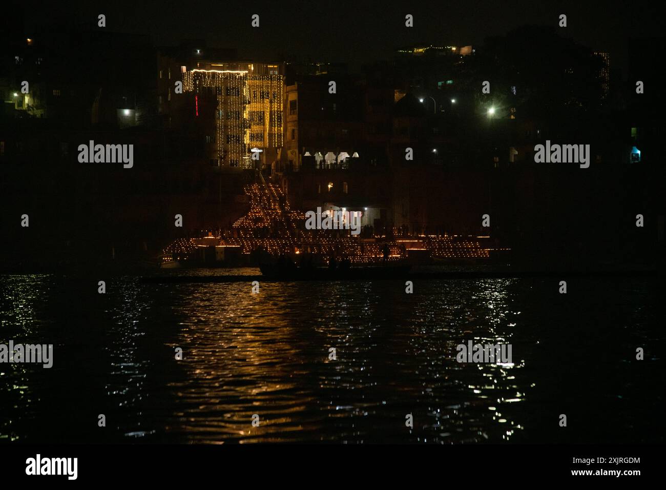 Varanasi ghat night light reflection hi-res stock photography and ...