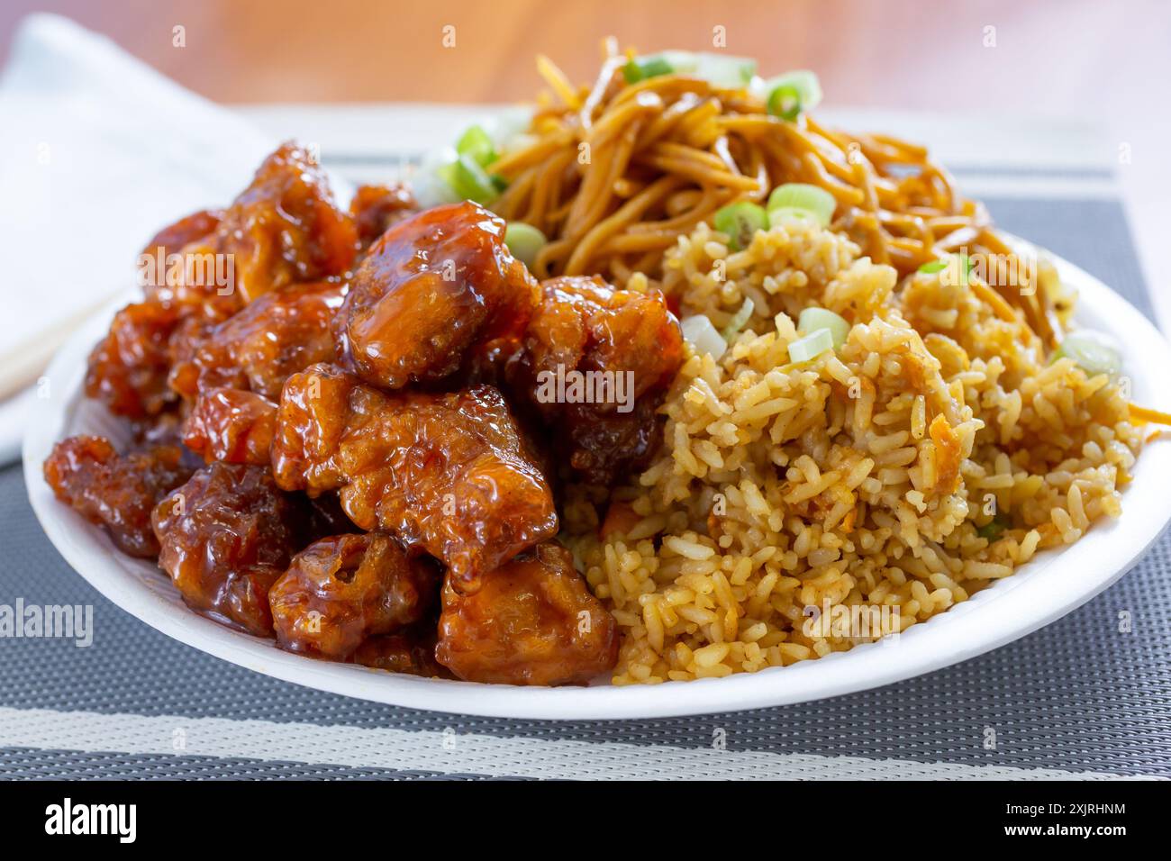 A view of a 1-item combo plate, featuring orange chicken, chow mein and ...