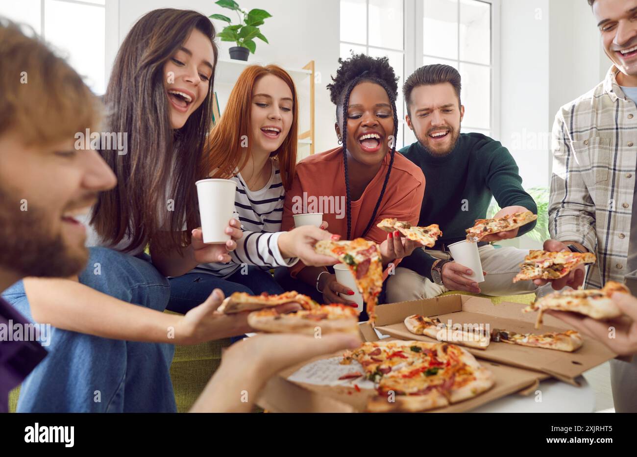 Young friends laughing dinner hi-res stock photography and images - Alamy
