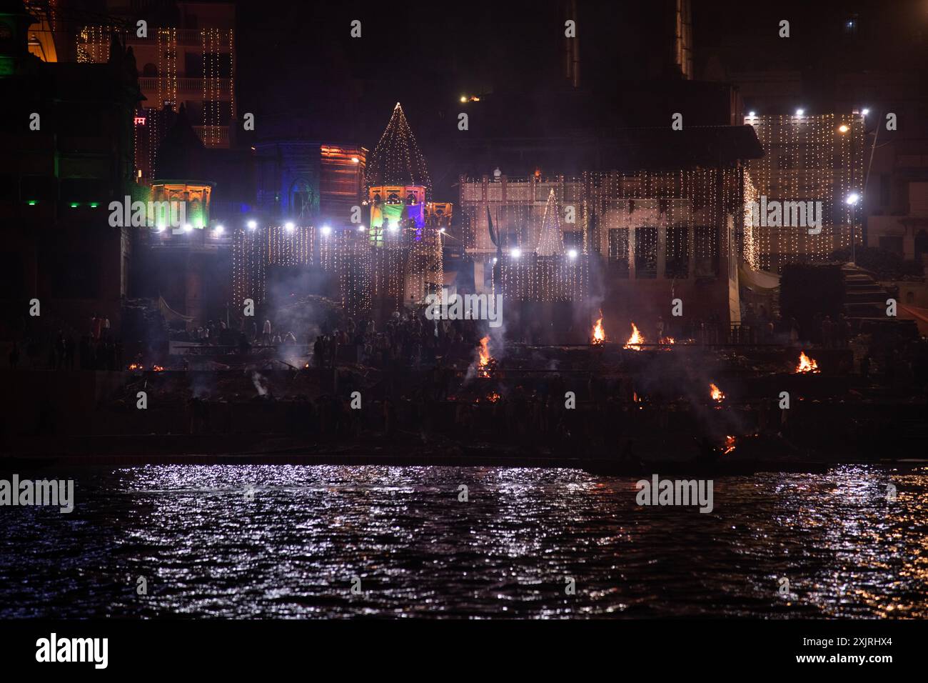 Varanasi ghat night light reflection hi-res stock photography and ...