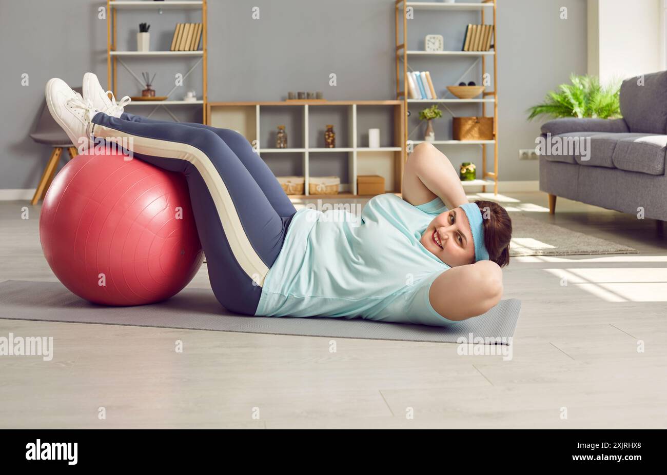 Woman doing abdominal exercises home hi-res stock photography and ...
