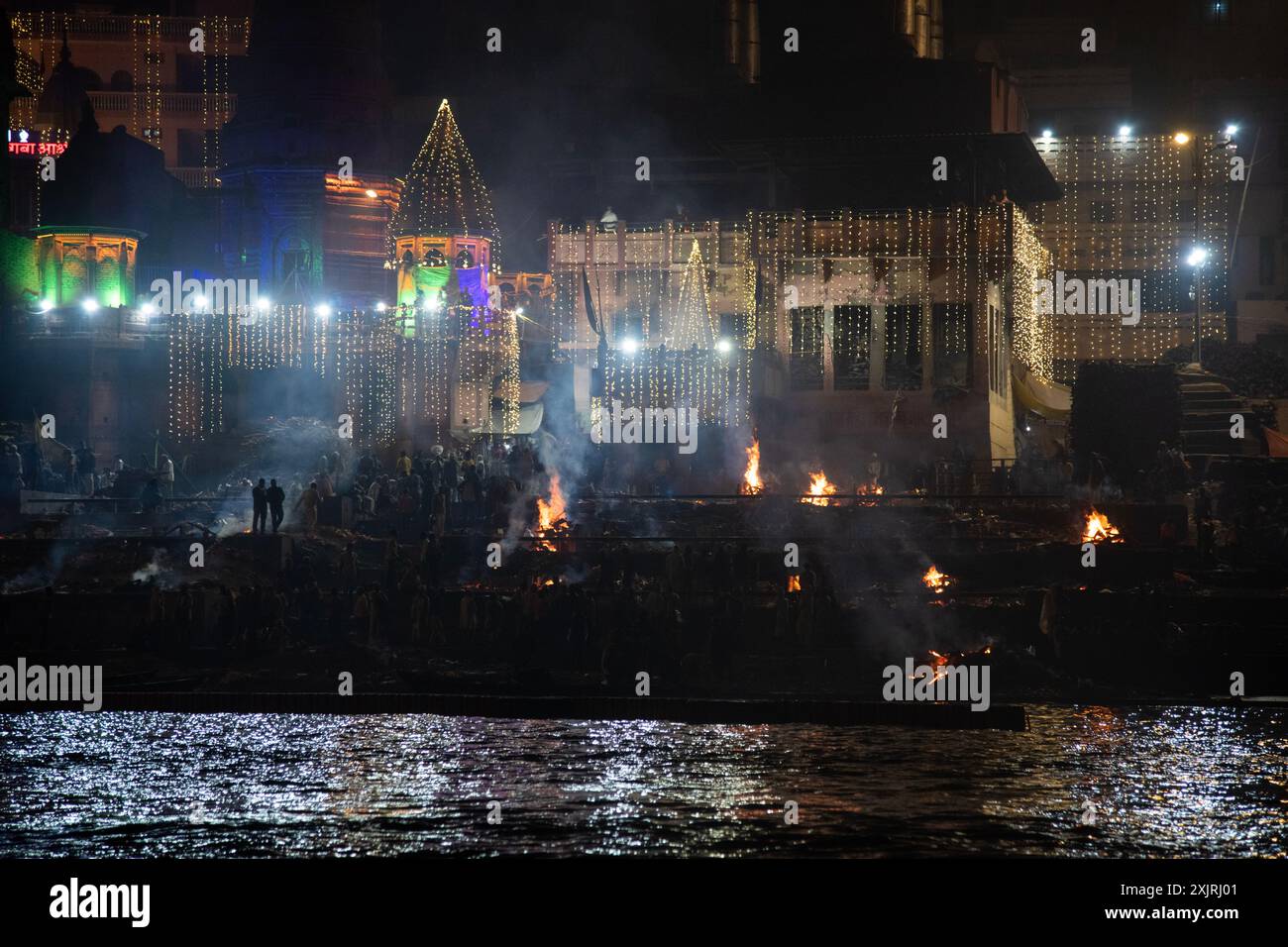 Varanasi ghat night light reflection hi-res stock photography and ...