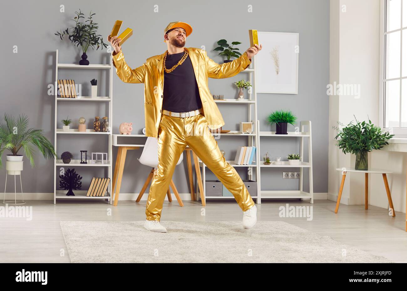 Holding gold bars hi-res stock photography and images - Alamy