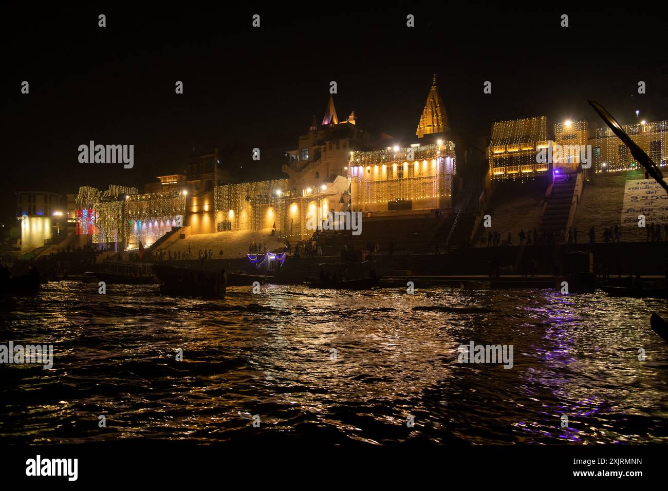Varanasi ghat night light reflection hi-res stock photography and ...