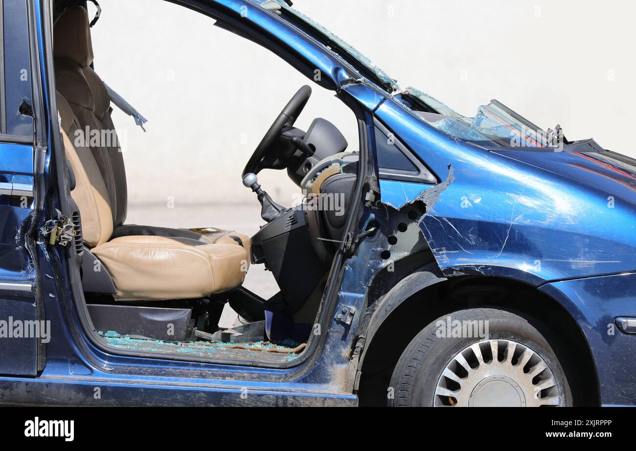 Car completely destroyed with broken windows after vandalism during ...