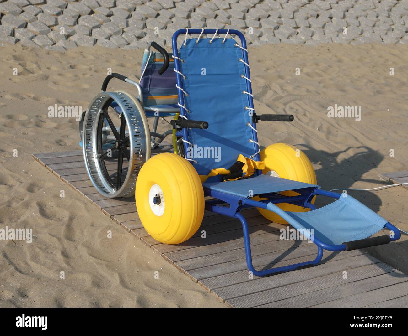 beach wheelchair going into the water with yellow inflatable and ...