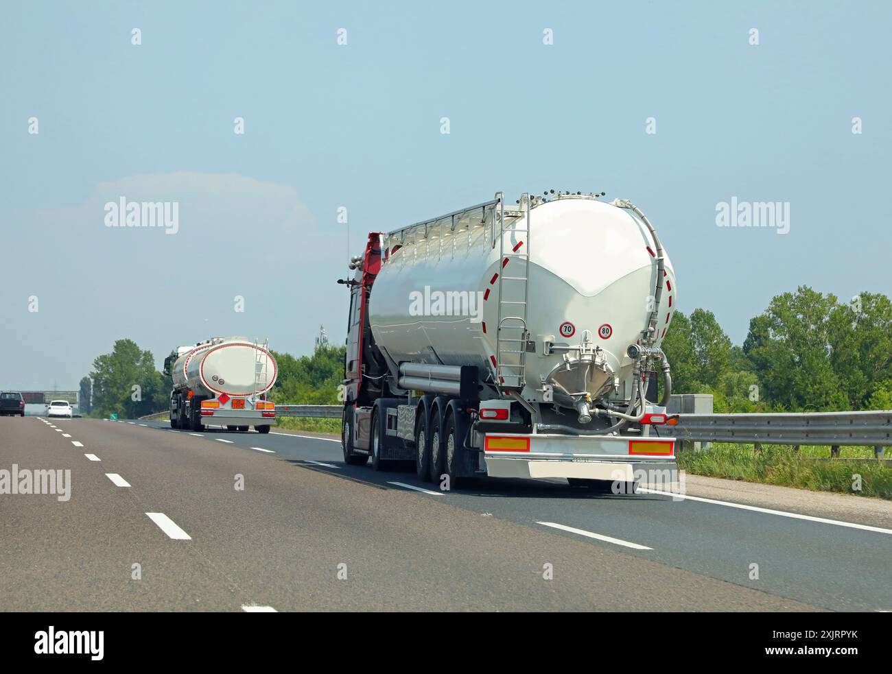 arge fuel tanker truck hauling flammable liquid on a desert highway ...