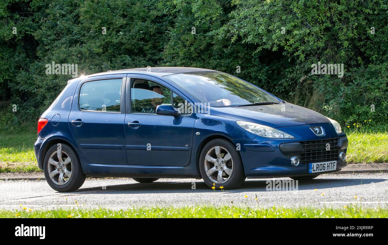 Milton Keynes,UK - July 18th 2024: 2006 blue Peugeot 307 car driving on ...