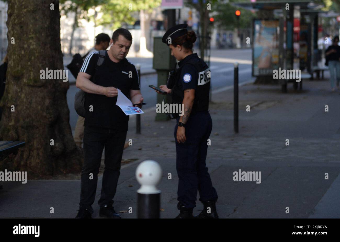 Gendarmerie officers check pedestrians QR codes at a barriers ...