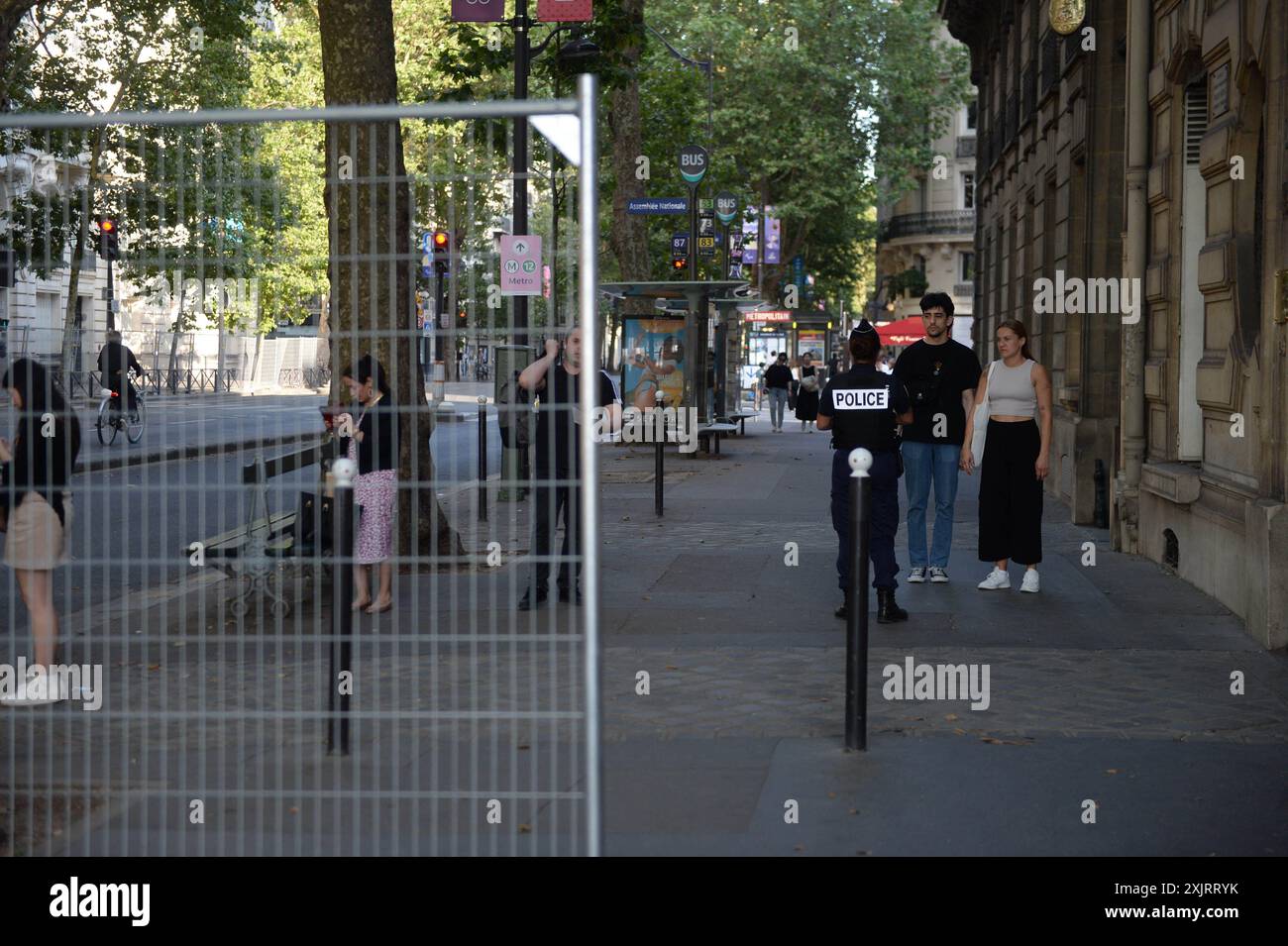 Gendarmerie officers check pedestrians QR codes at a barriers ...