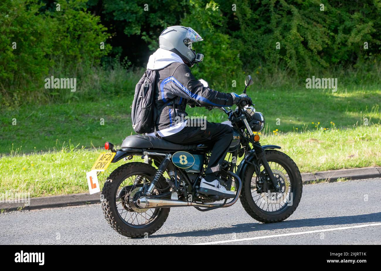 Milton Keynes,UK - July 18th 2024: Man riding a 2021 Herald sm 125 25b ...