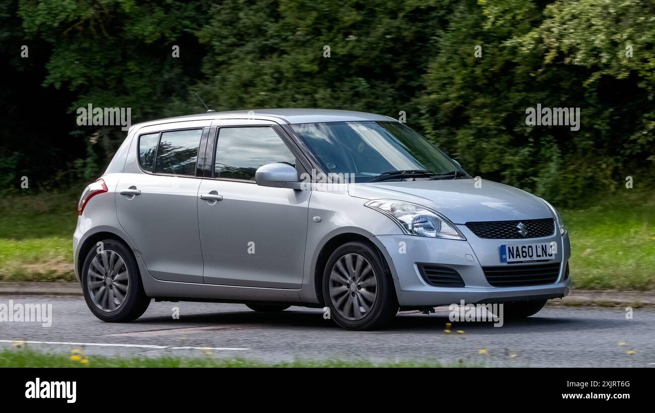 Milton Keynes,UK - July 18th 2024: 2010 silver Suzuki Swift hatchback ...