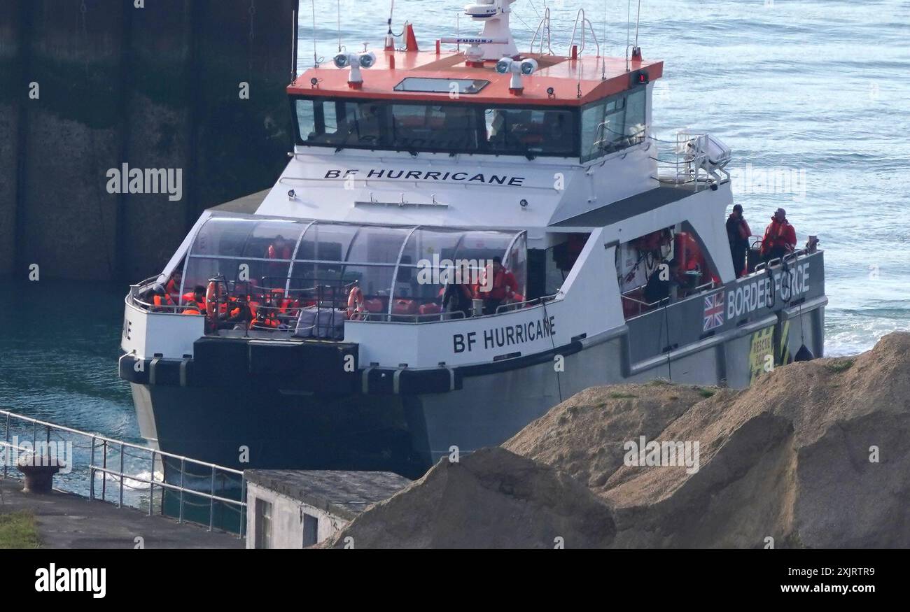 A group of people thought to be migrants are brought in to Dover, Kent, onboard a Border Force ...
